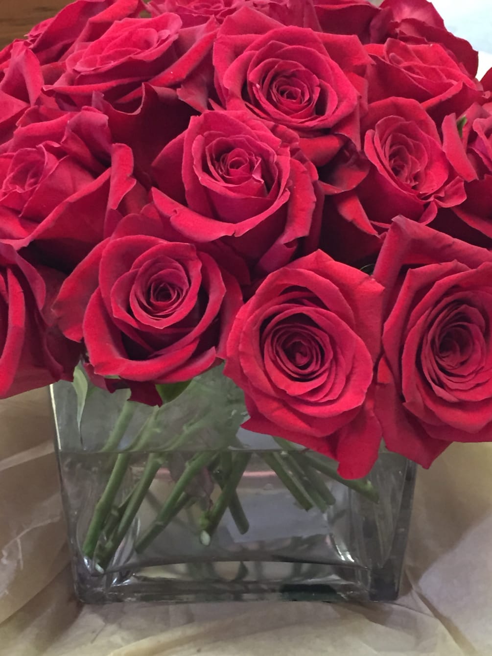 Red roses in 6x6 vase by Flowers Made With Love