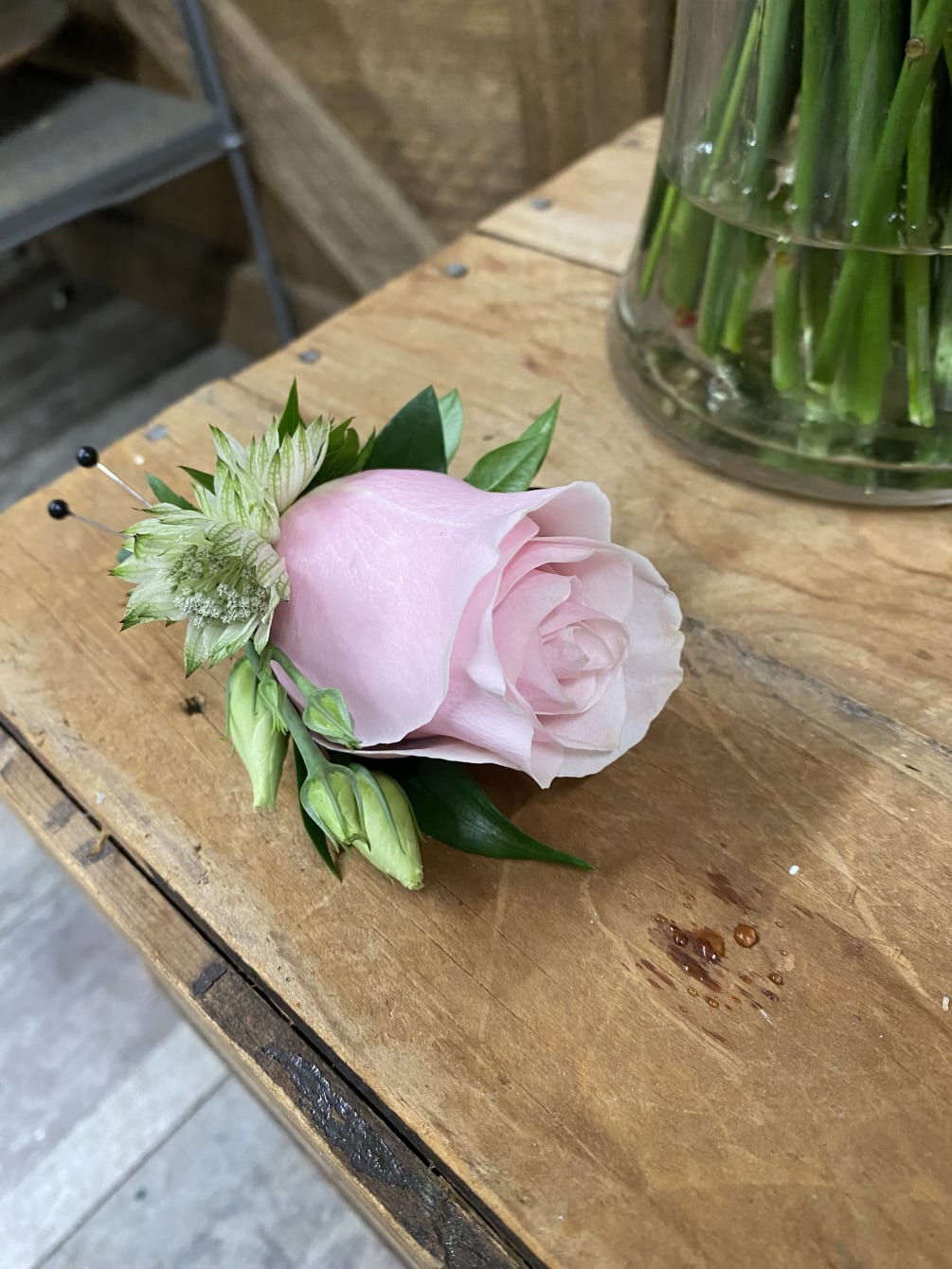Pink rose boutonniere by Luna's Flower Shop