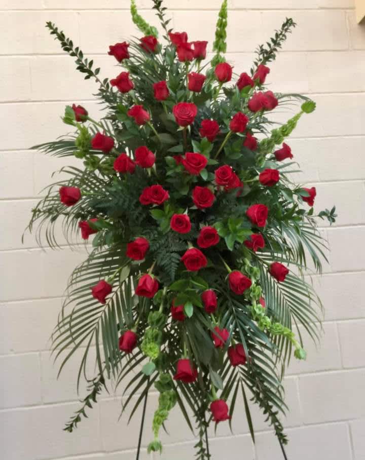 funeral flowers on stand by Beverly Hills Floral Design Center