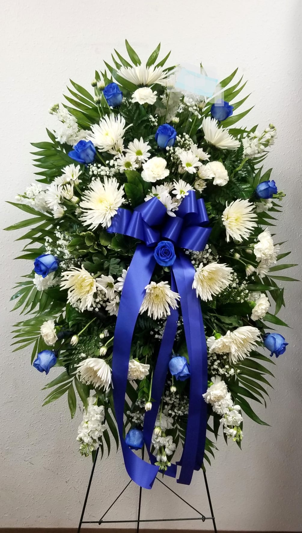 BLUE AND WHITE MIXED FLOWER STANDING SPRAY by Xochitl Flowers & Gifts