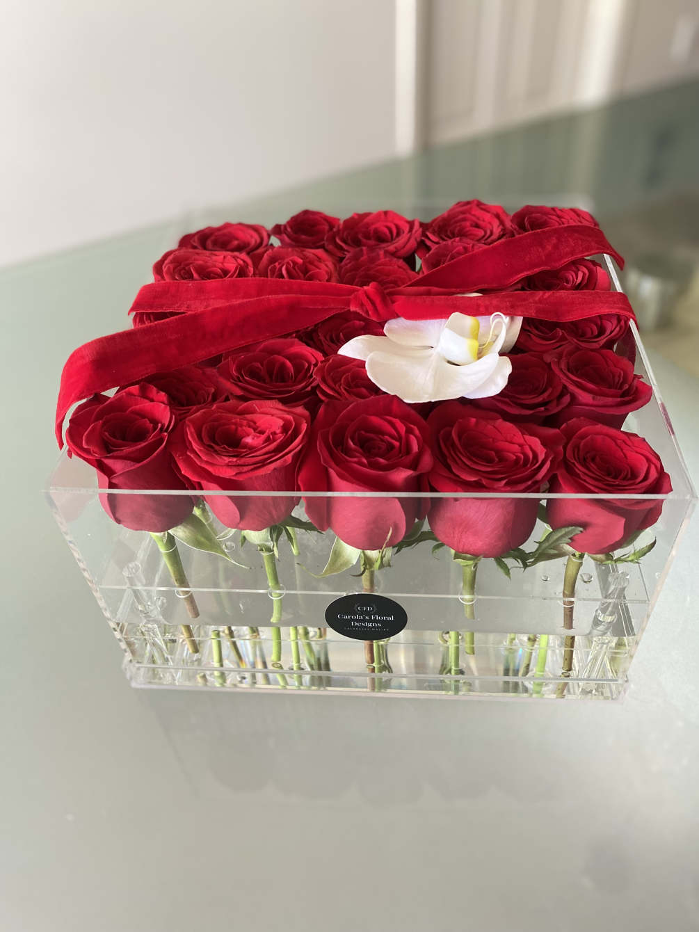 Clear Rose Box by Carola's Floral Designs