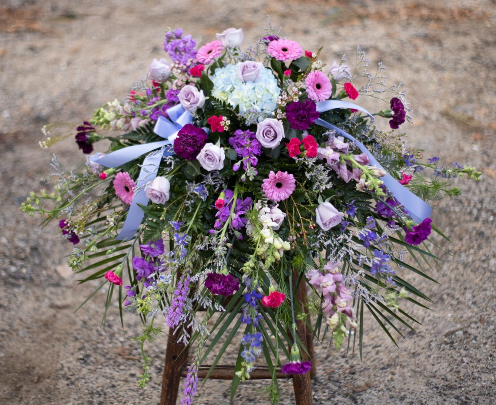 Lavender fields casket spray. in Uxbridge, MA | Lucille's Floral Designs
