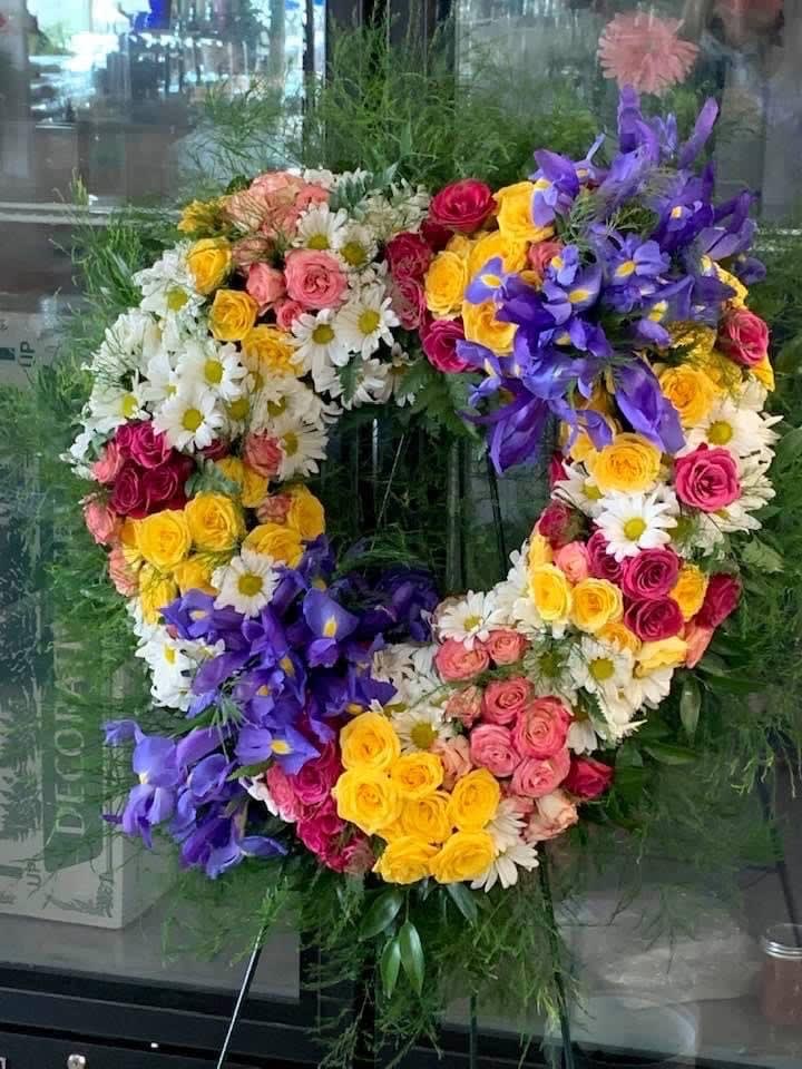 spray roses, iris, daisy by Andrews Flowers