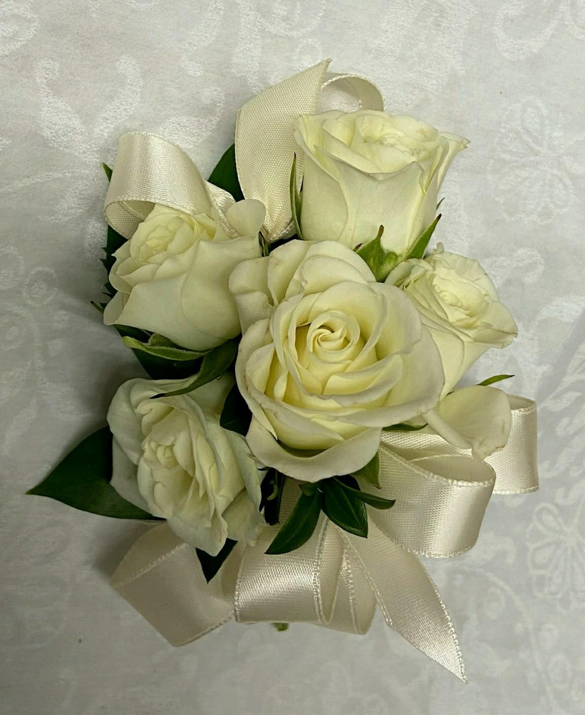 white spray rose wrist corsage by Wholesale Flowers