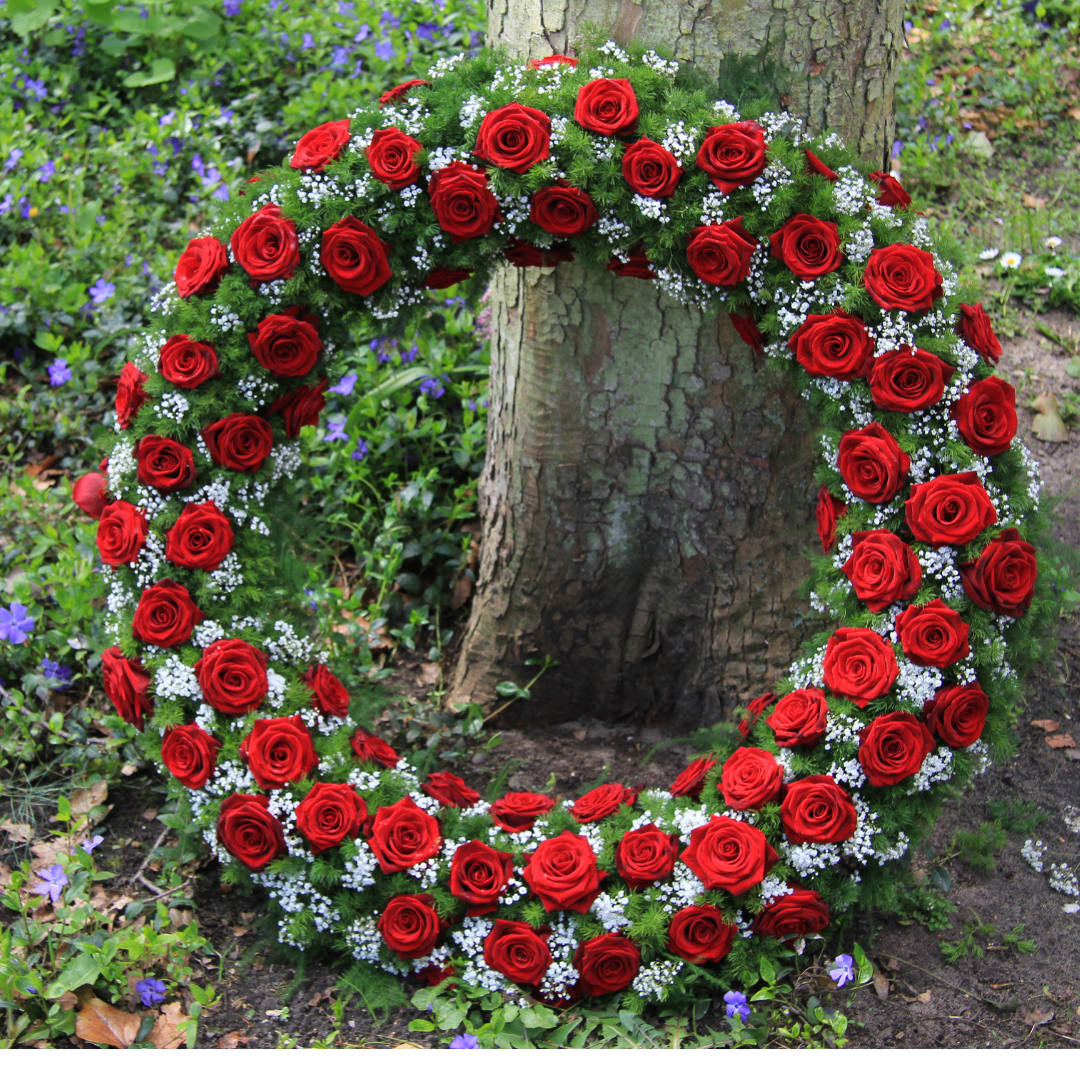 Red Rose Wreath Standing Sprayby Duckworth Florals
